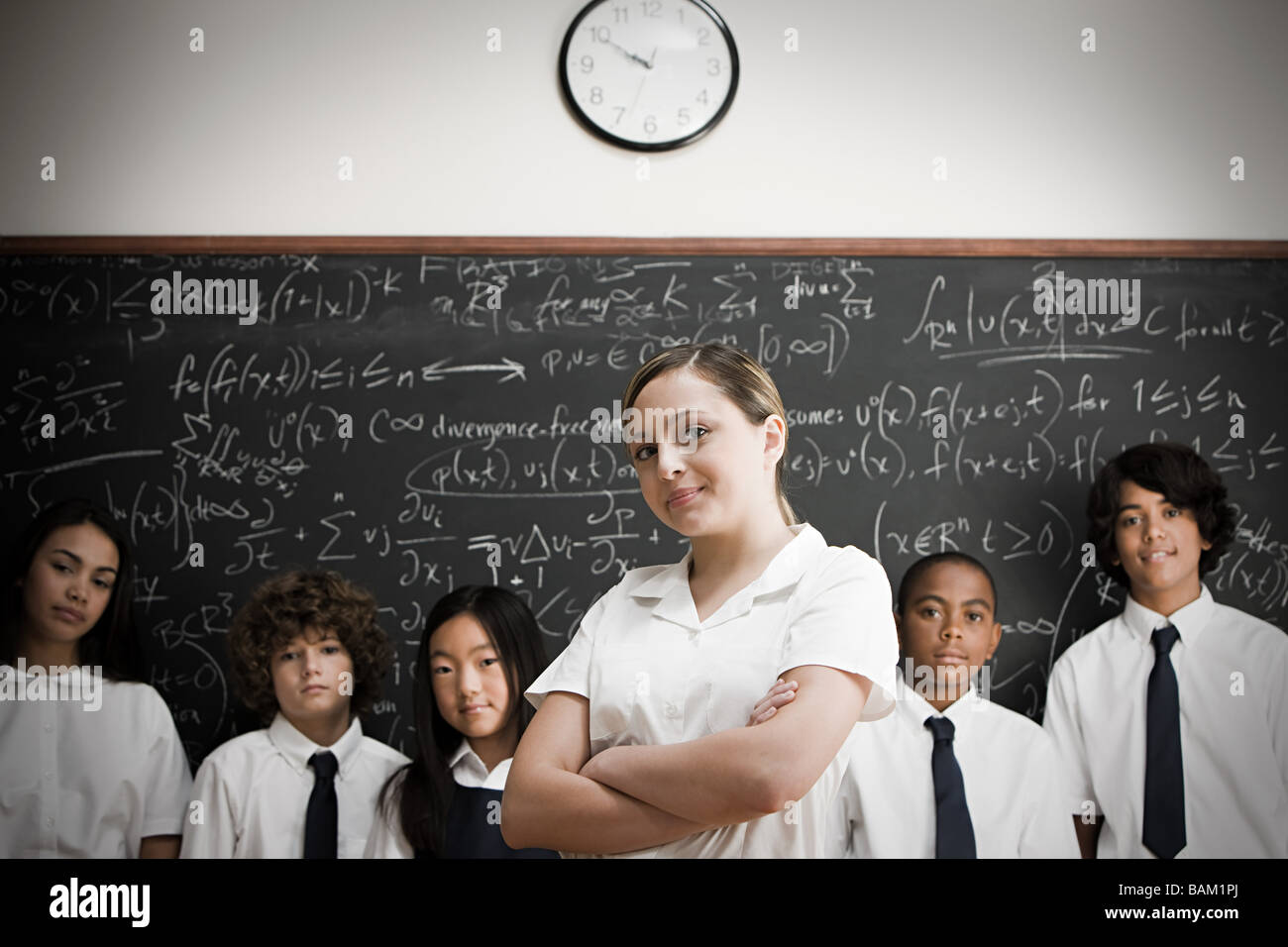 Students in front of blackboard Stock Photo - Alamy