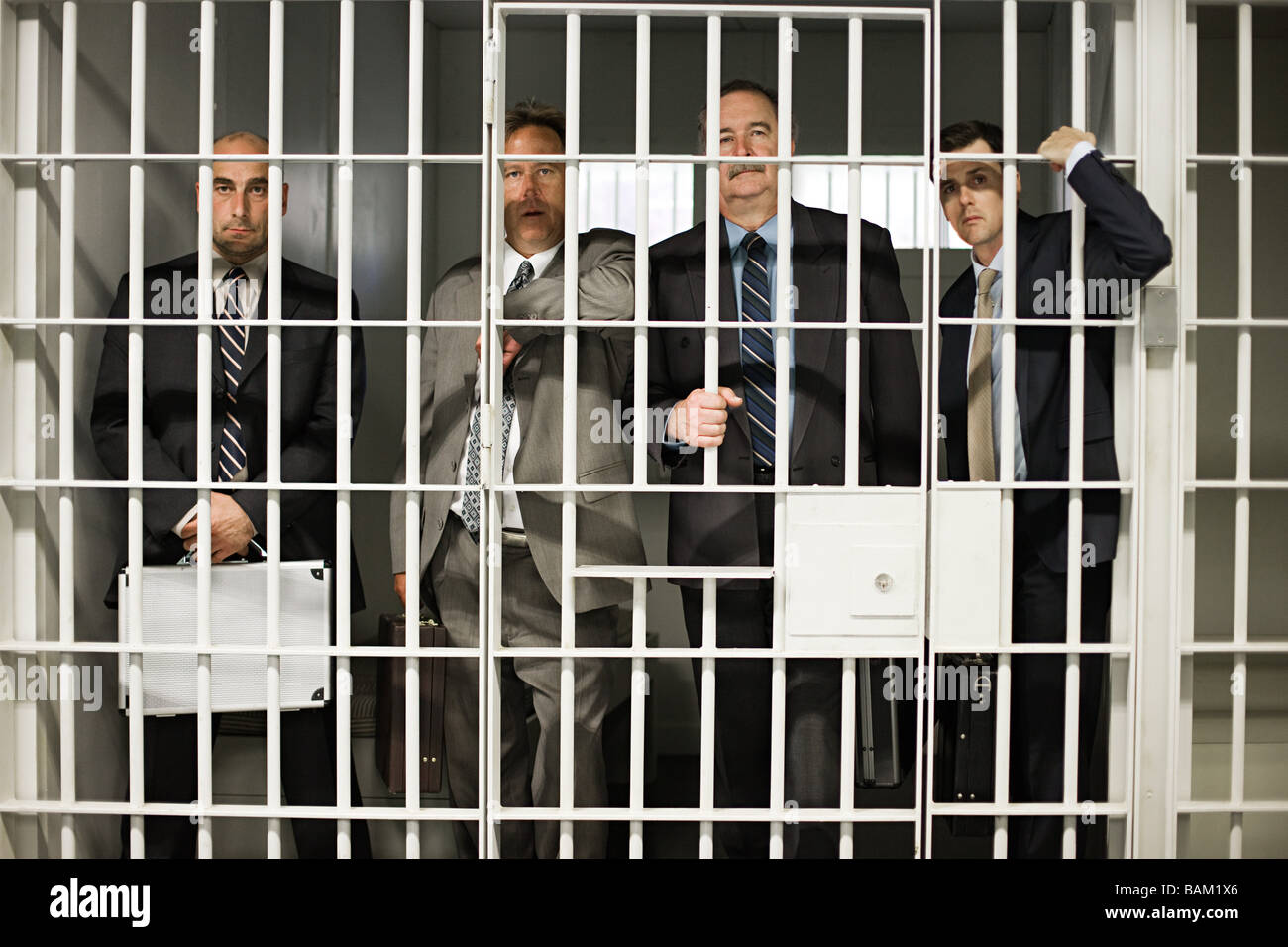 Businessmen in jail Stock Photo - Alamy
