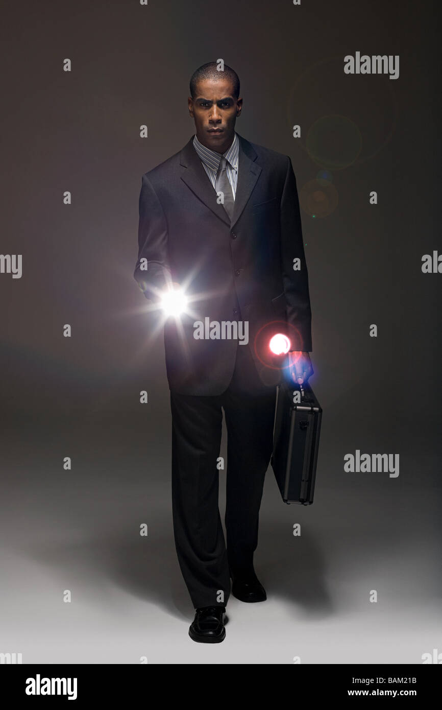 Businessman with torch Stock Photo - Alamy