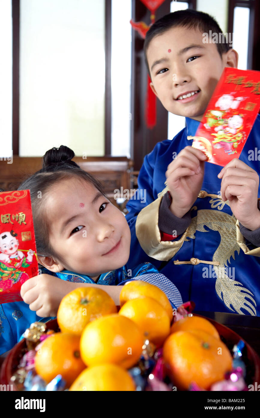 Traditionally Dressed Children Celebrating Chinese New Year Stock Photo ...
