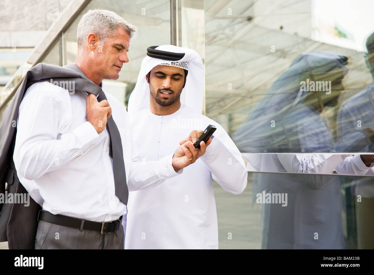 A businessman showing cell phone Stock Photo - Alamy