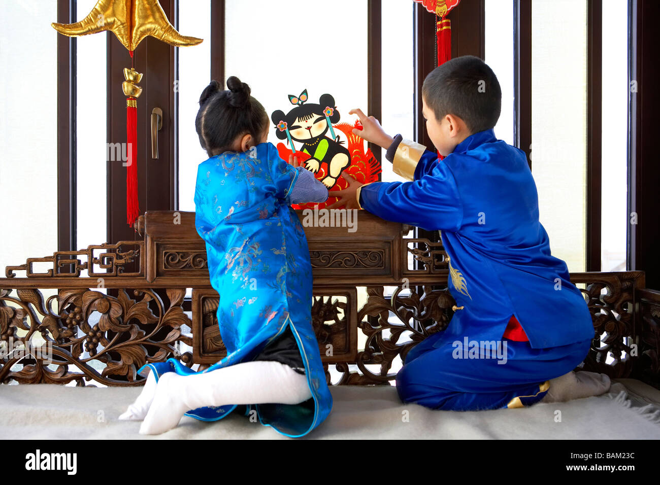 Traditionally Dressed Children Playing In Traditional Interior Stock ...