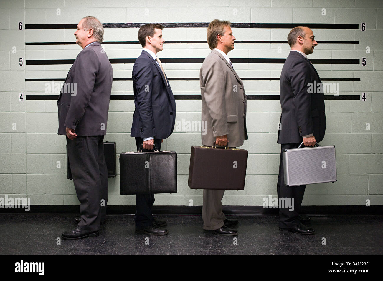 Businessmen in lineup Stock Photo - Alamy