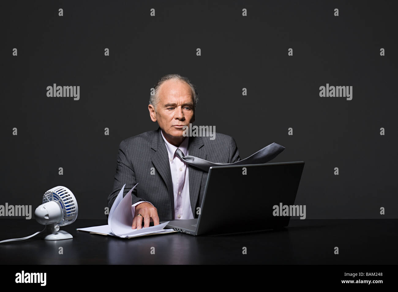 Businessman with fan Stock Photo - Alamy
