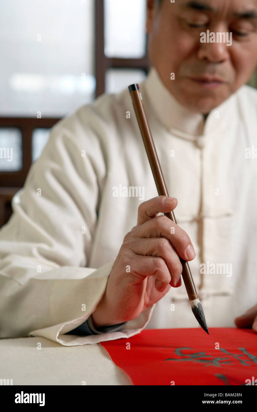 Senior Man Doing Calligraphy Stock Photo - Alamy
