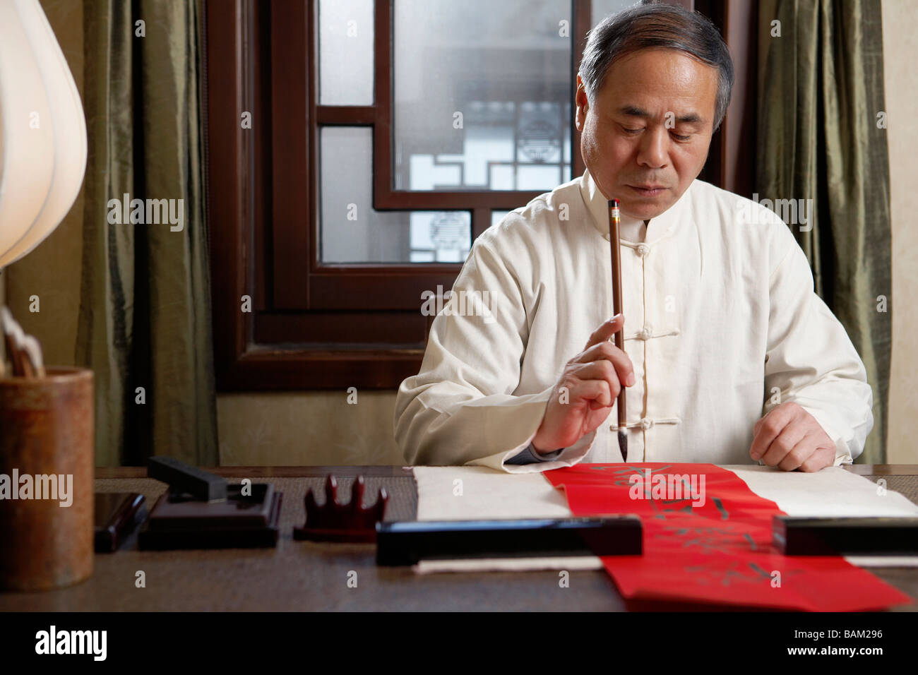 Senior Man Doing Calligraphy Stock Photo - Alamy