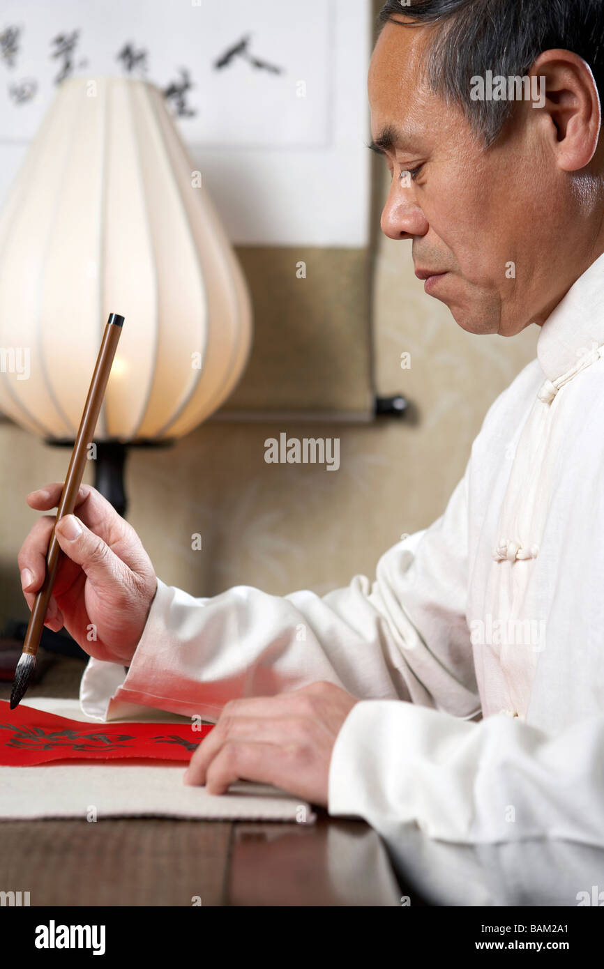 Senior Man Doing Calligraphy Stock Photo - Alamy