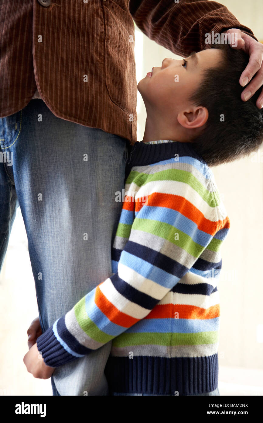 Son Hugging His Fathers Leg Stock Photo - Alamy