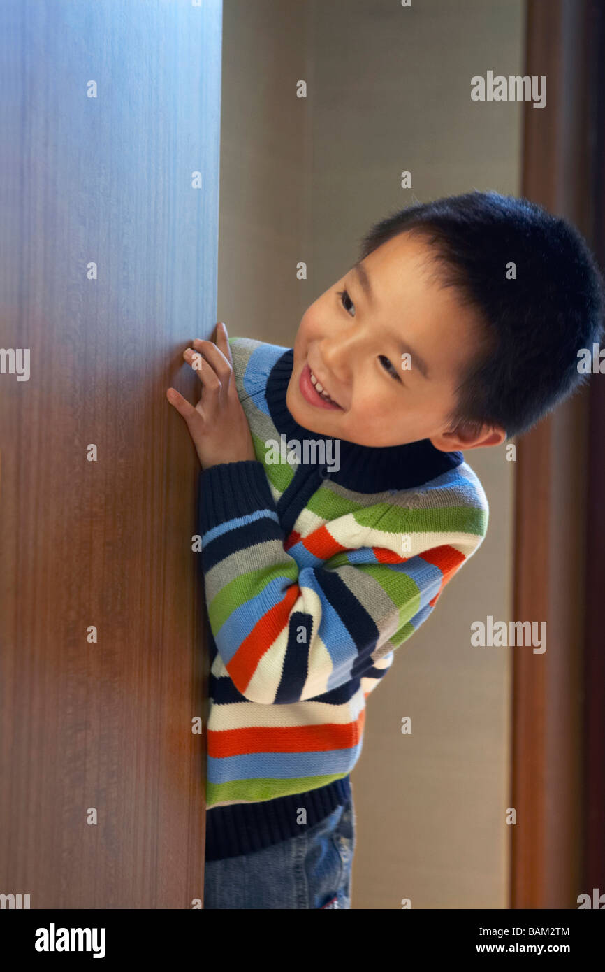 Peeking around door hi-res stock photography and images - Alamy