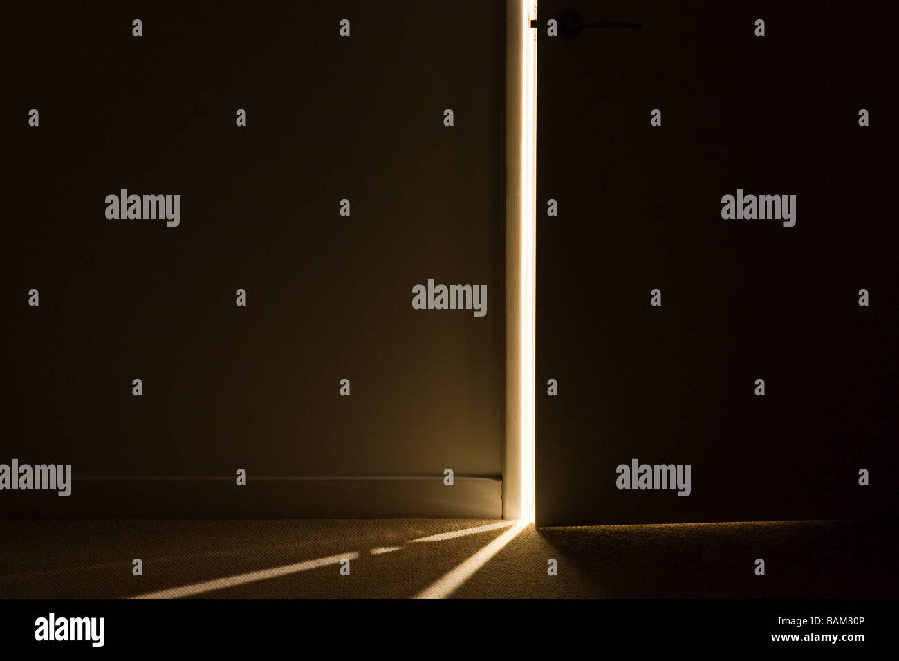 Light through the gap of an open door Stock Photo - Alamy
