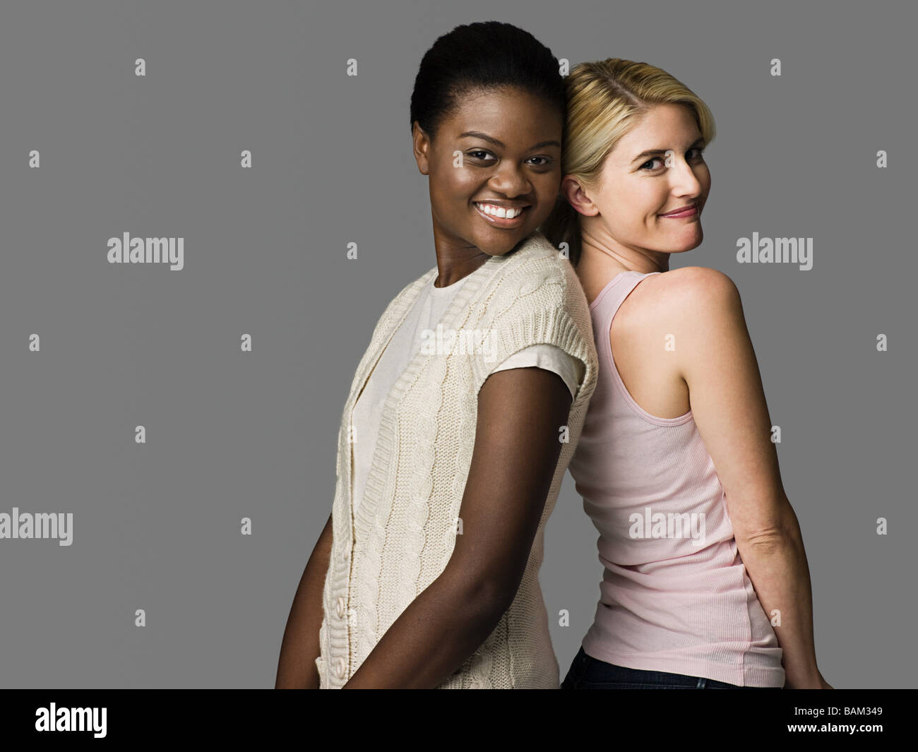 Women back to back Stock Photo - Alamy