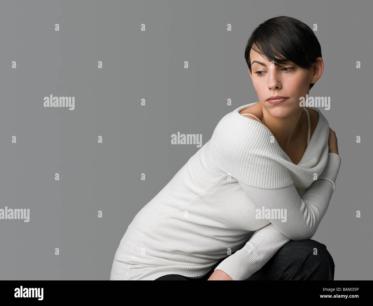 Young woman looking sad Stock Photo - Alamy