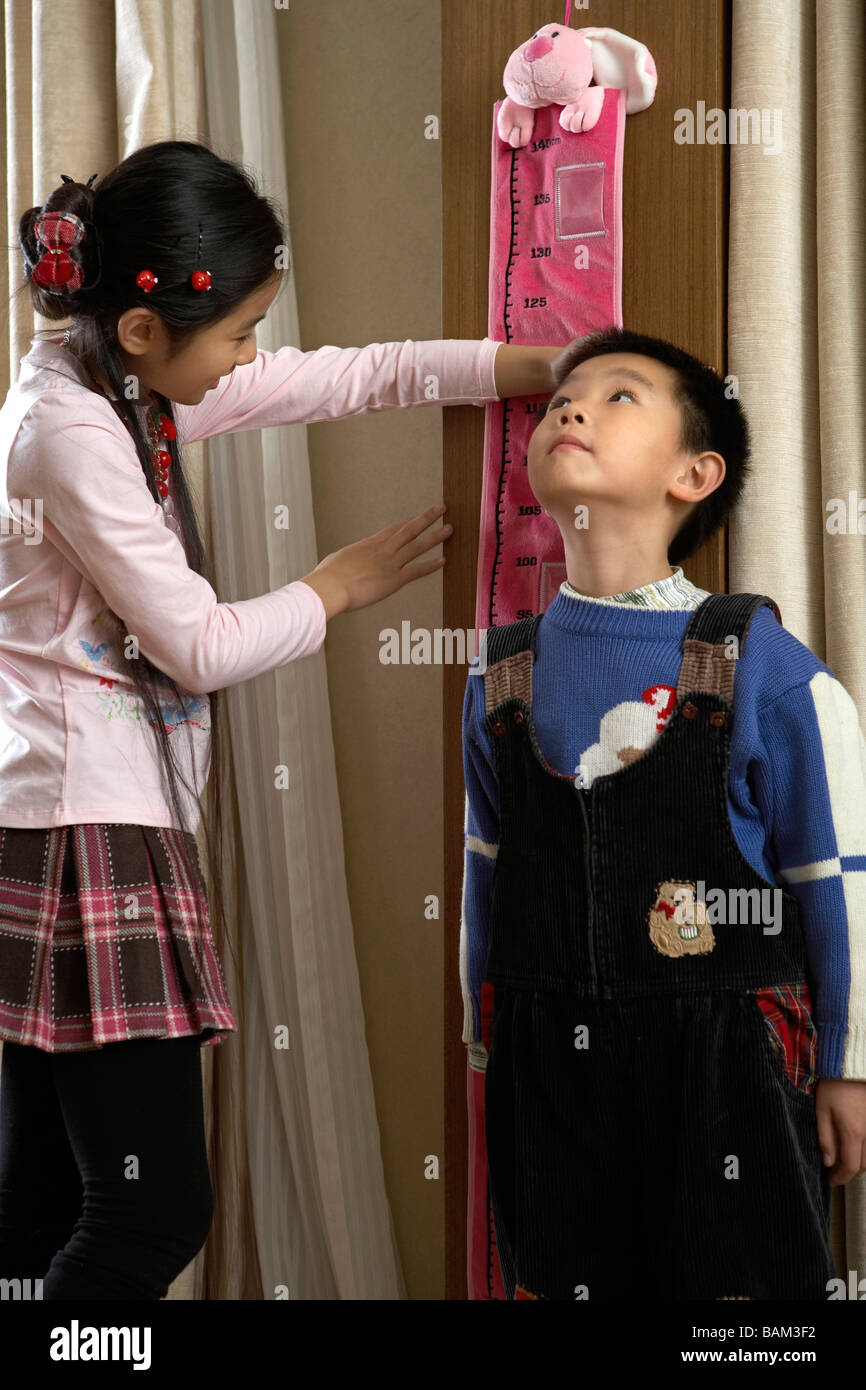 Children Measuring Height Stock Photo - Alamy
