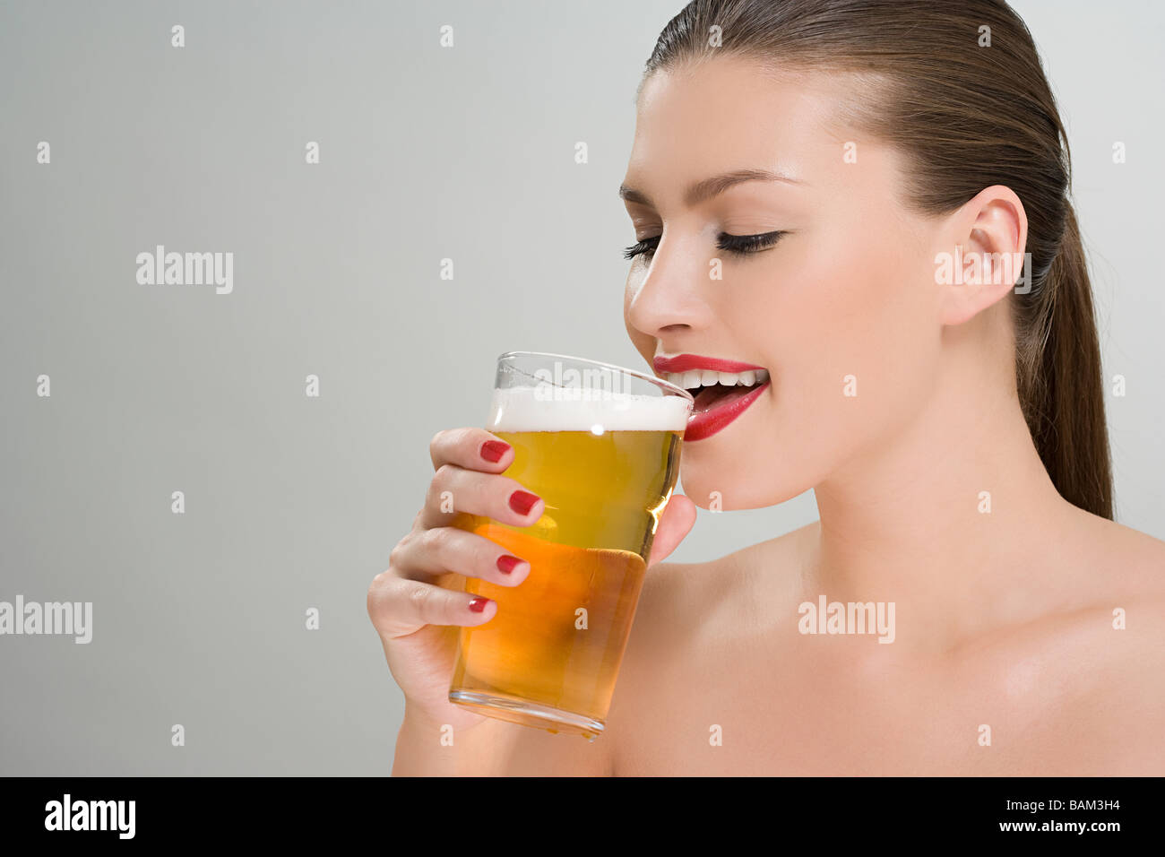 Woman drinking pint lager in hi-res stock photography and images - Alamy
