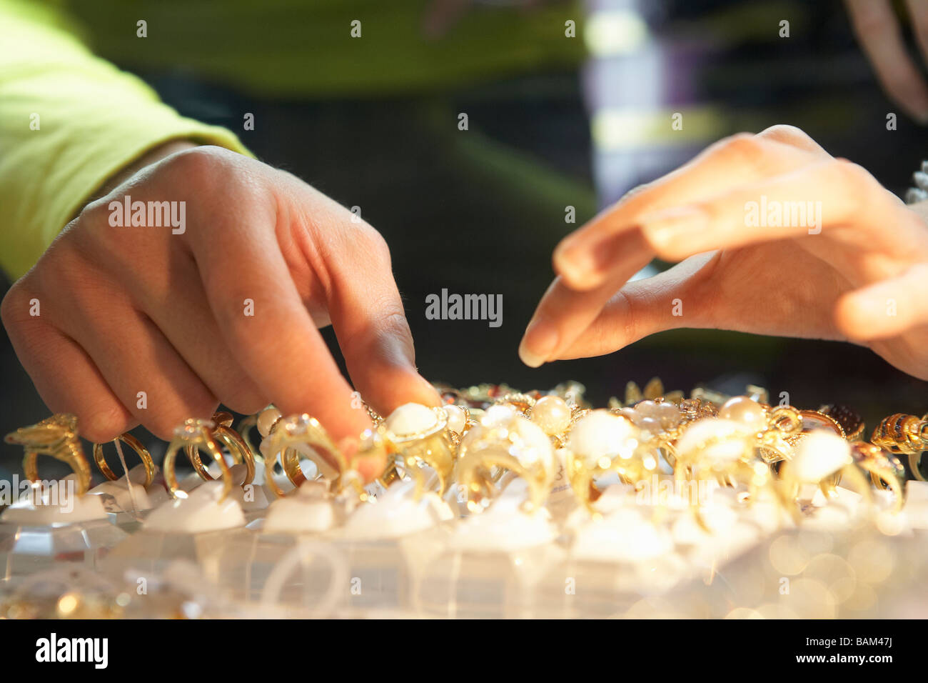 Person Looking At Gold Rings Stock Photo - Alamy