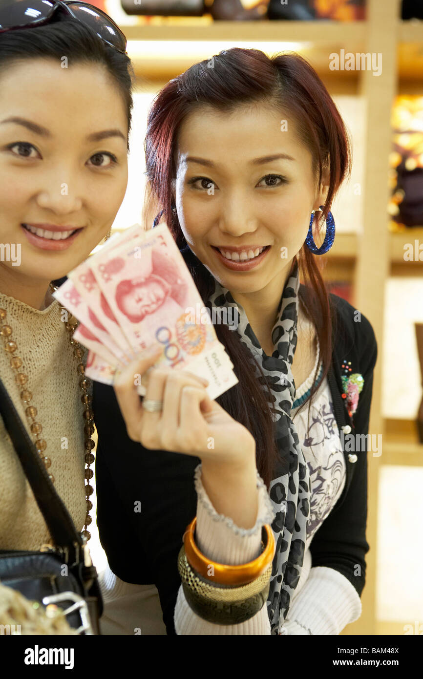 Two Young Girls Posing For Photograph With A Handful Of Cash Stock ...