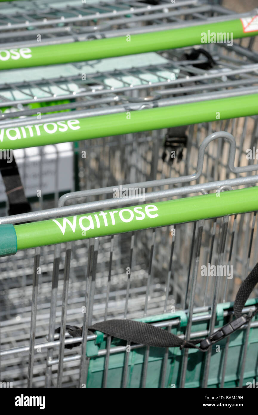 Empty Waitrose shopping trolleys stacked in a trolley bay Stock Photo ...
