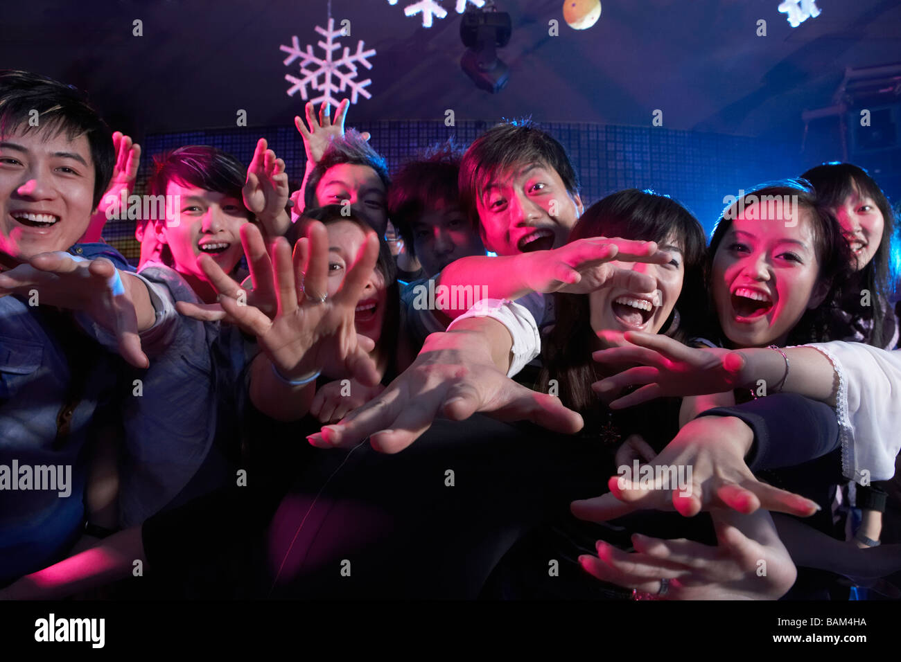 A Crowd Of Excited Young People At A Music Concert Stock Photo - Alamy