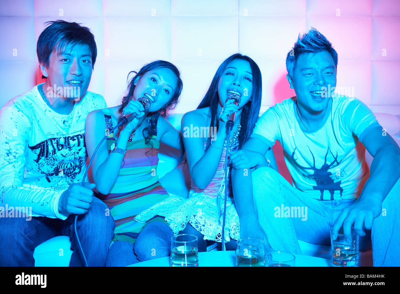 Group of women singing microphones hi-res stock photography and images ...