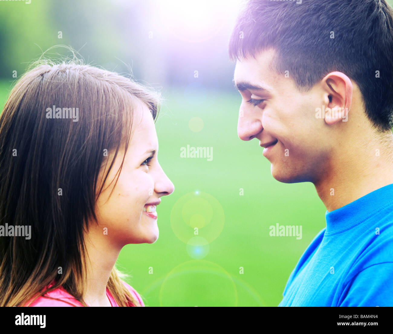 Young couple in love looking each other deeply in the eyes Stock Photo ...