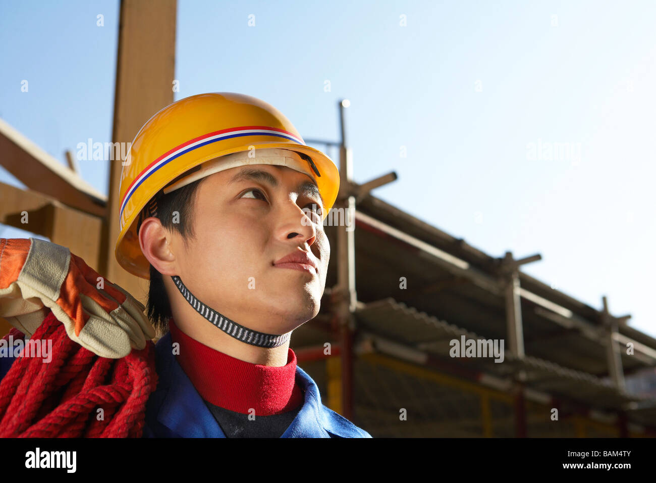 Worker Wearing Hard Hat In Construction Site Stock Photo - Alamy