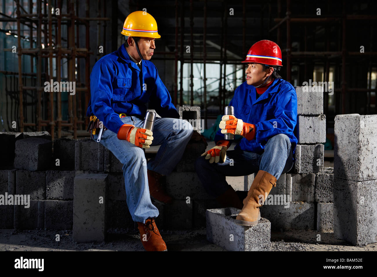 Men In Construction Site Wearing Hard Hats Stock Photo - Alamy