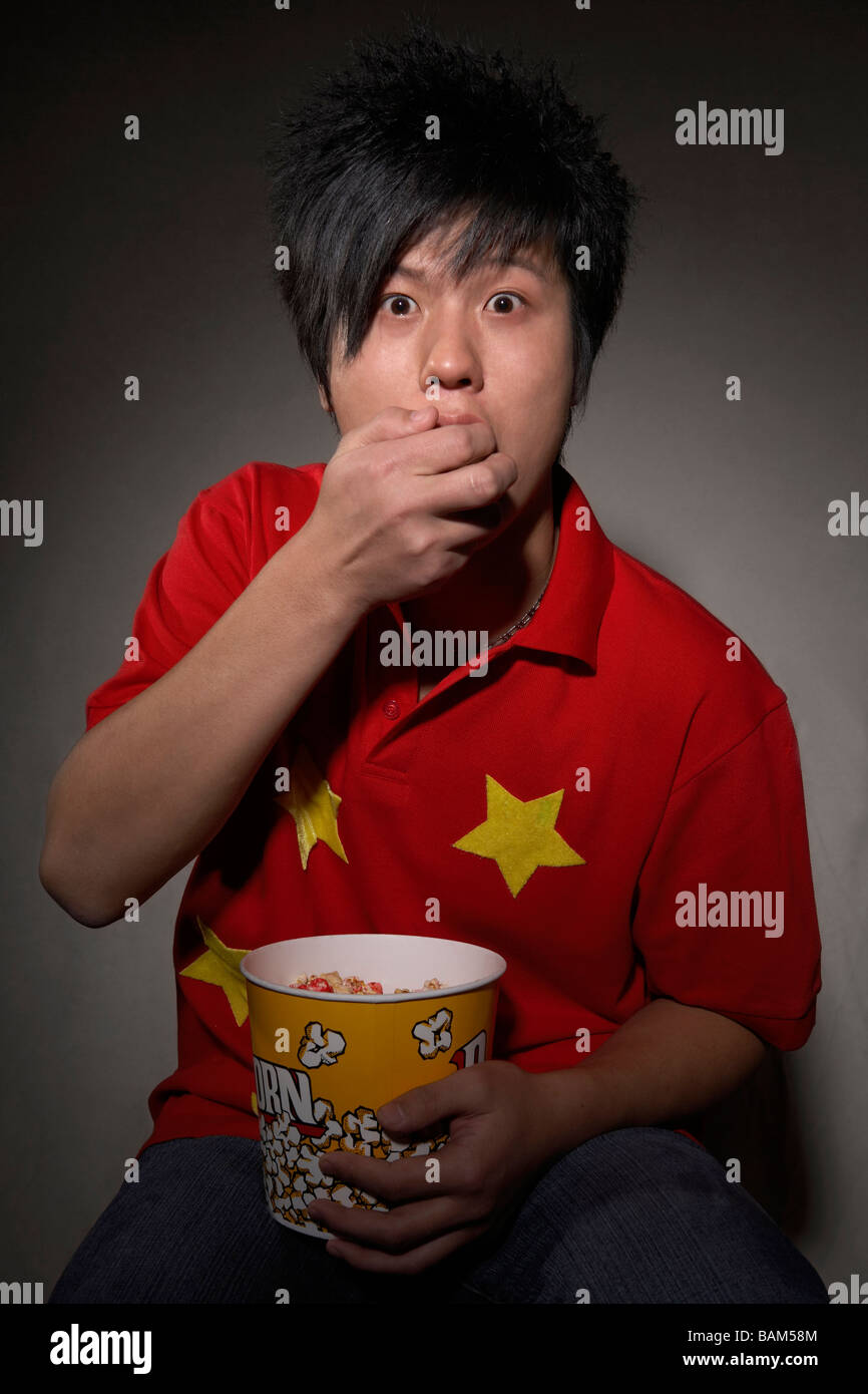 Chinese Male Eating Popcorn Stock Photo - Alamy