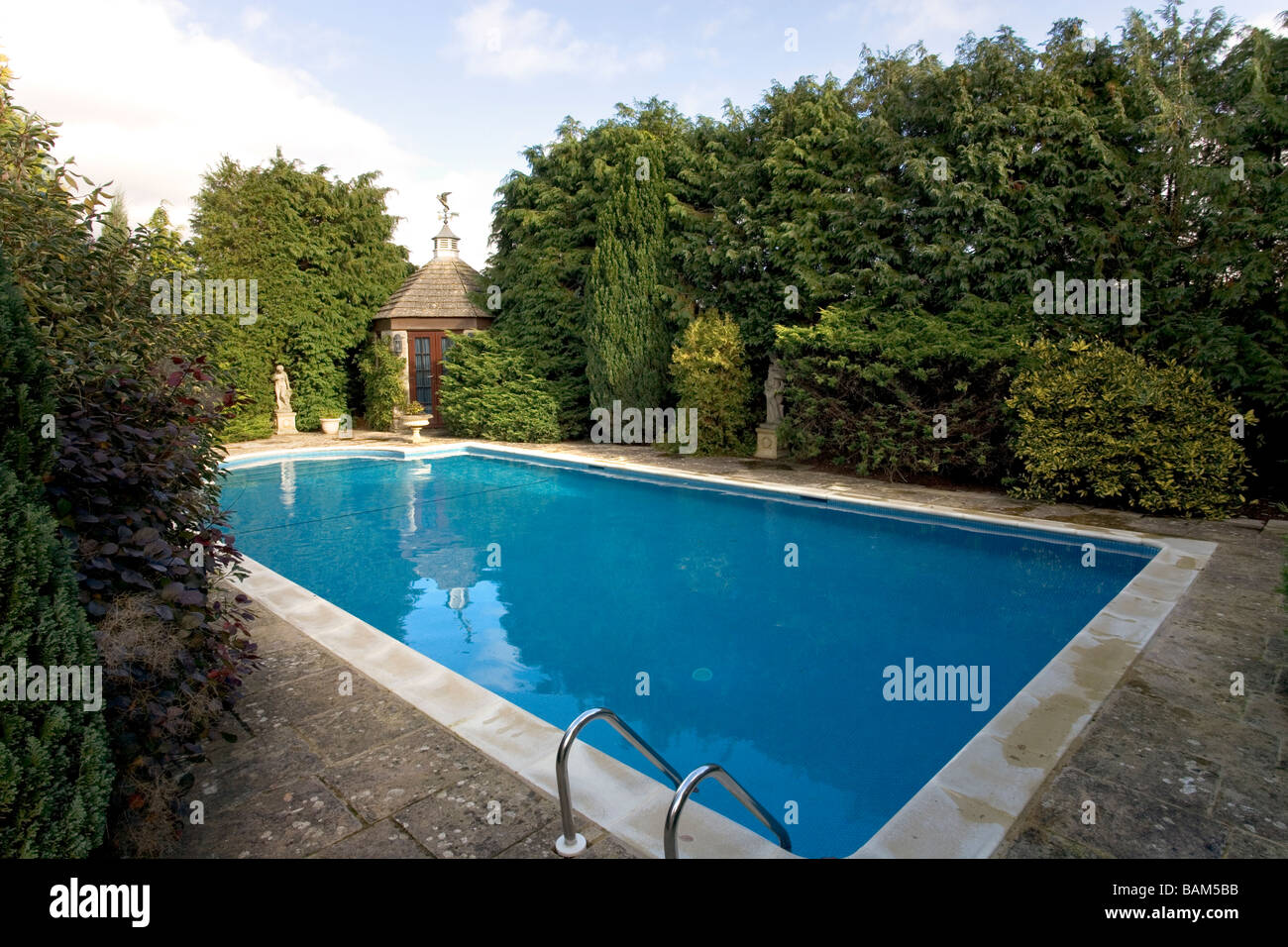 UK. A private garden swimming pool Stock Photo - Alamy
