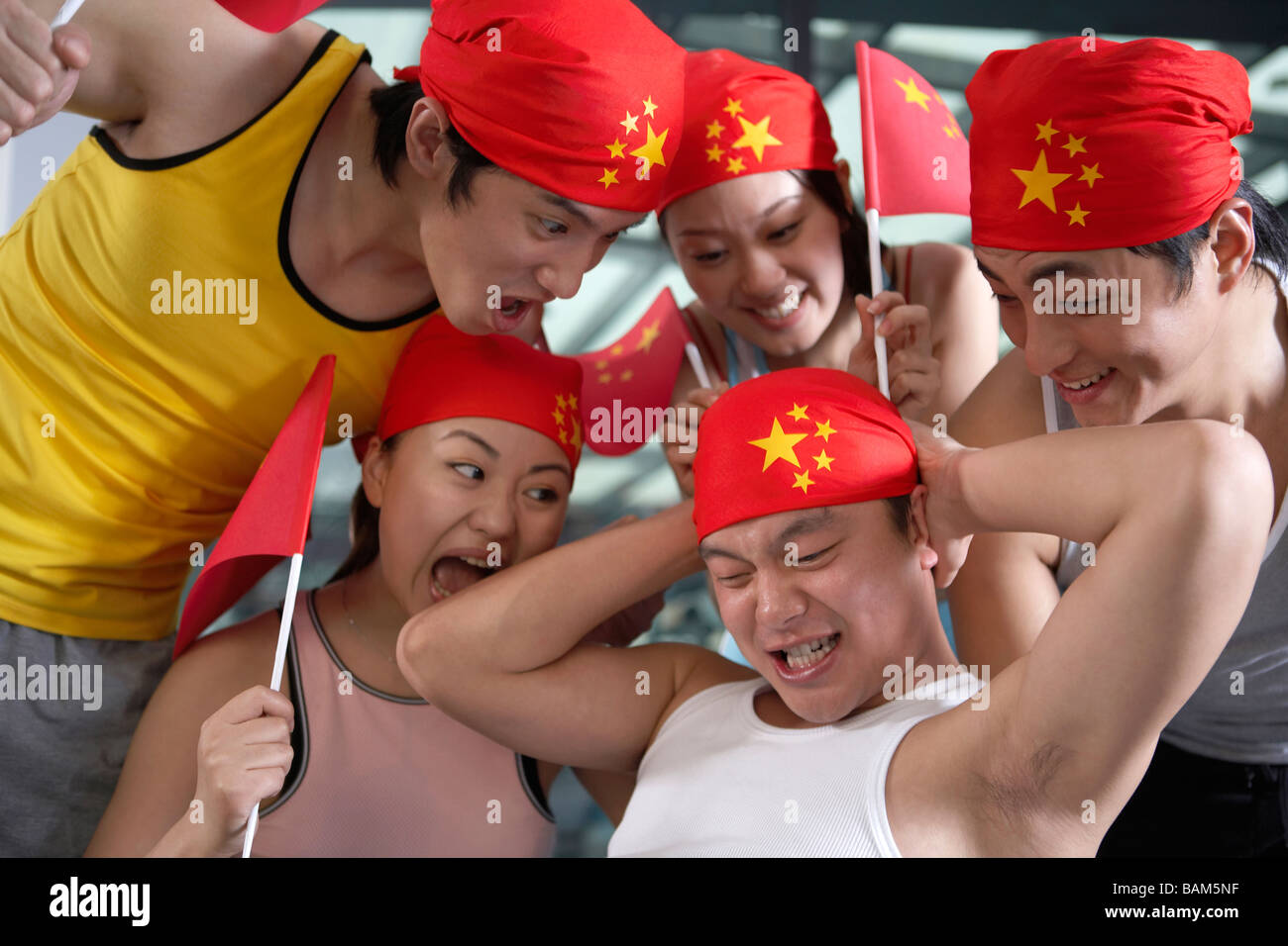 Young Man Doing Sit-Ups Being Cheered On Stock Photo - Alamy