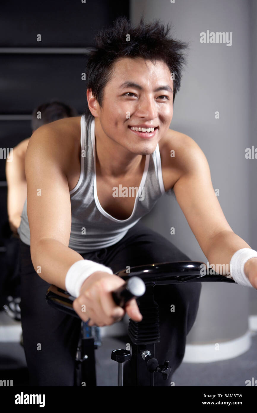 Happy Young Man Exercising Stock Photo - Alamy