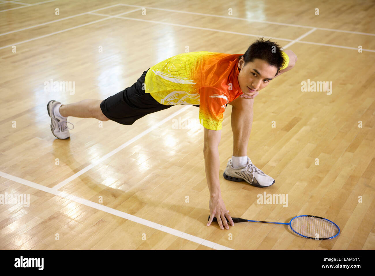 Tennis Player Stretching On Court Stock Photo - Alamy
