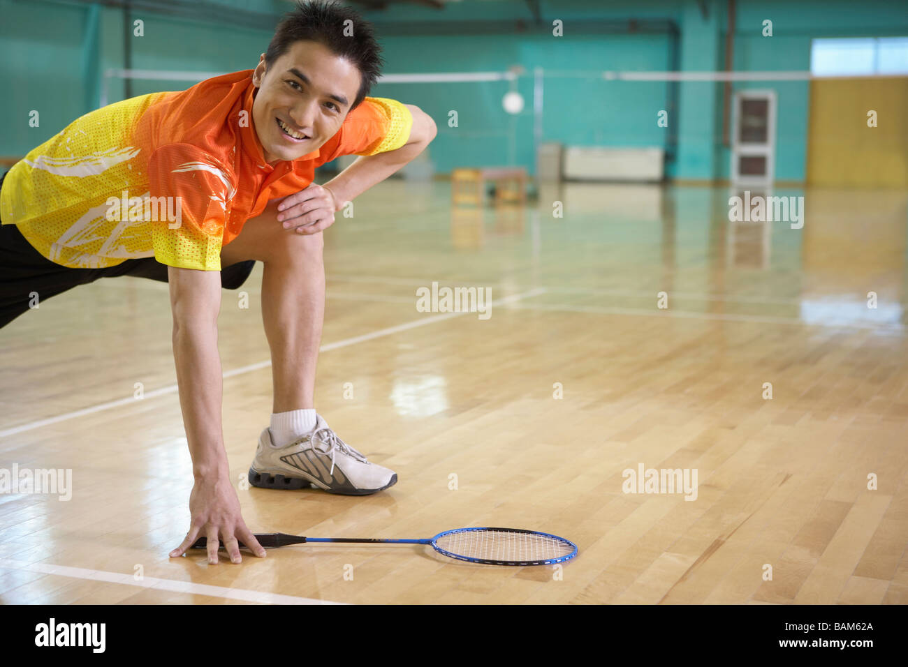 Tennis Player Stretching On Court Stock Photo - Alamy