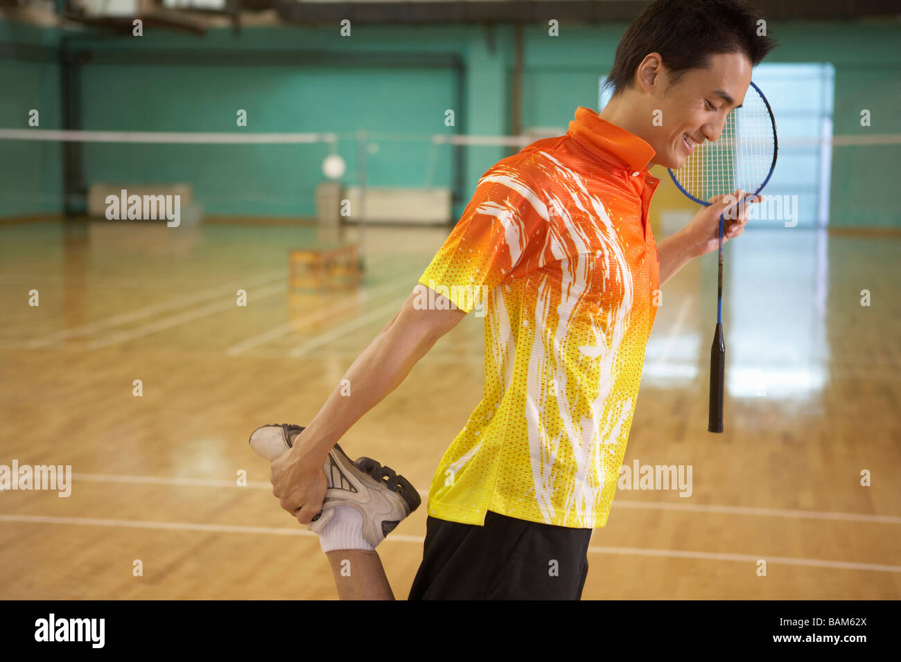 Tennis Player Stretching On Court Stock Photo - Alamy