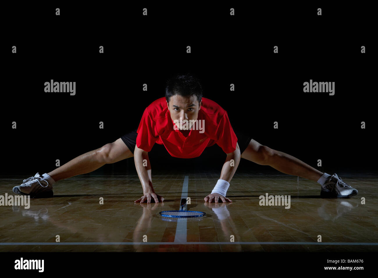 Young Man Stretching During A Game Of Badminton Stock Photo - Alamy