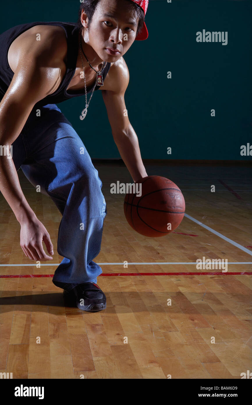 Hip Young Man Playing Basketball On Court Stock Photo - Alamy