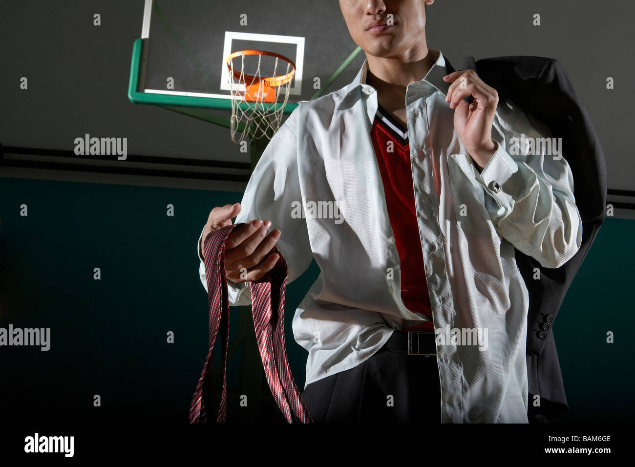 Disheveled Looking Business Man On Basketball Court Stock Photo - Alamy