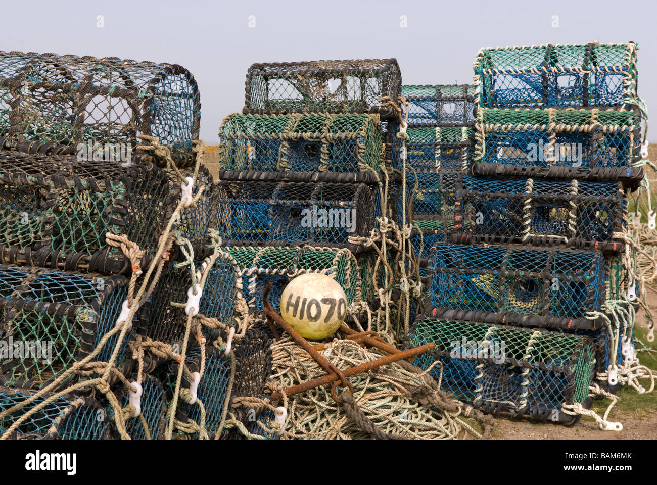 A stack of lobster pots on the quay at Spurn Point East Yorkshire ...
