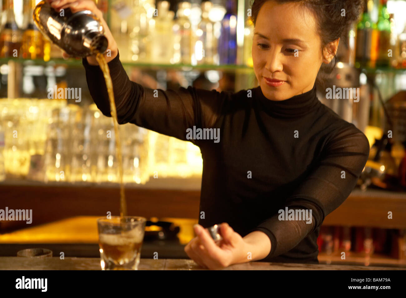 Bartender Pouring Drink Stock Photo - Alamy