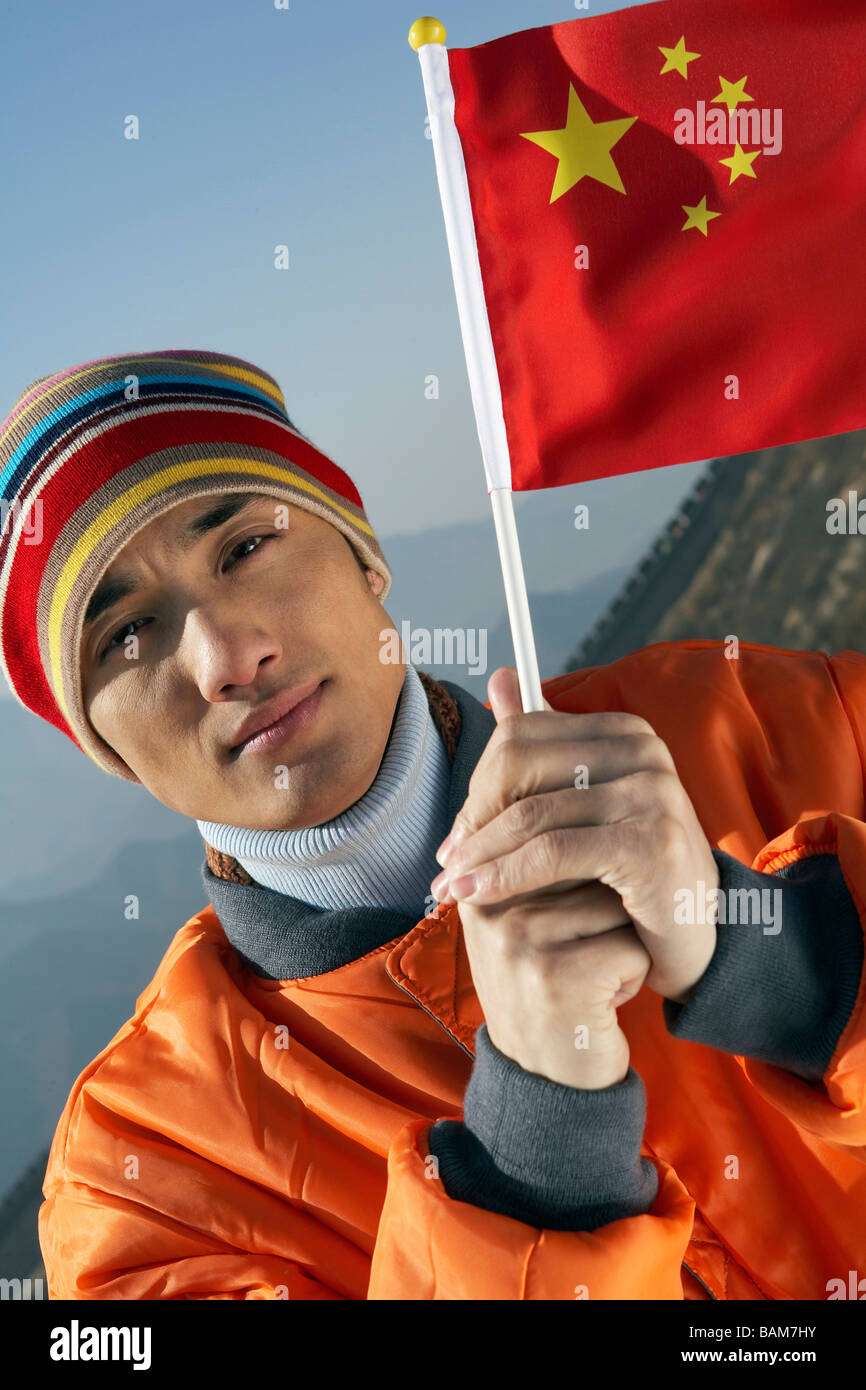 Man Waving A Flag On The Great Wall Of China Stock Photo - Alamy