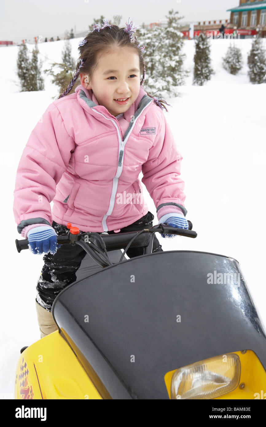 Young Girl Riding Snowmobile Stock Photo - Alamy