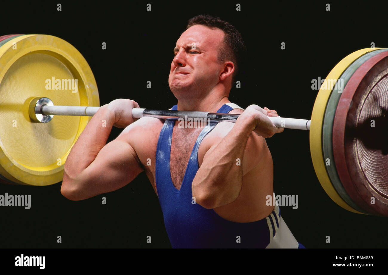 Olympic style weightlifter in action Stock Photo - Alamy