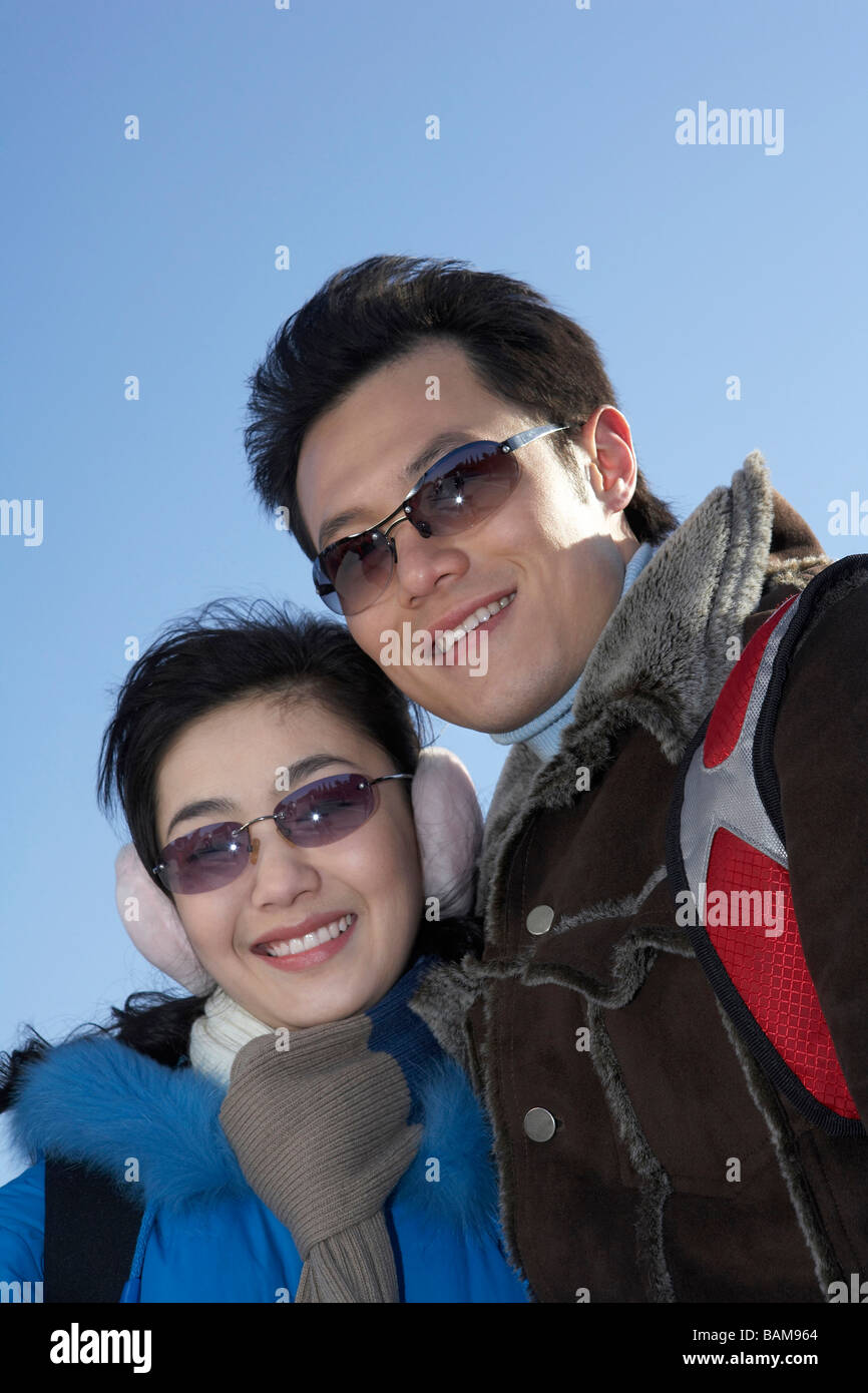 Couple Smiling, Looking Into The Distance Stock Photo - Alamy