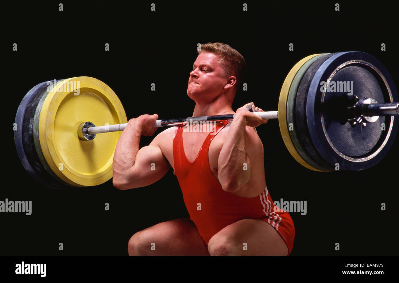 Olympic style weightlifter in action Stock Photo - Alamy