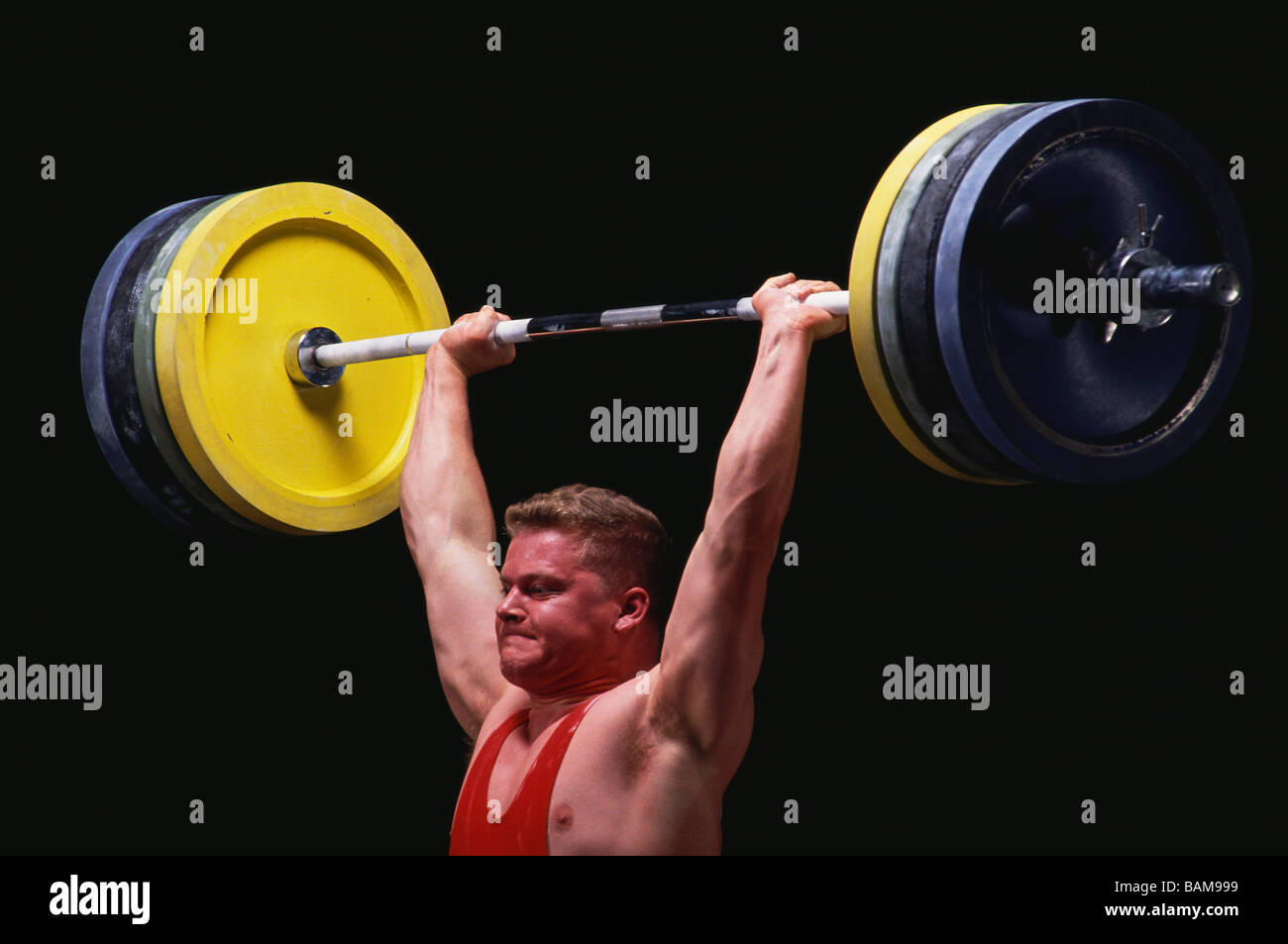 Olympic style weightlifter in action Stock Photo - Alamy