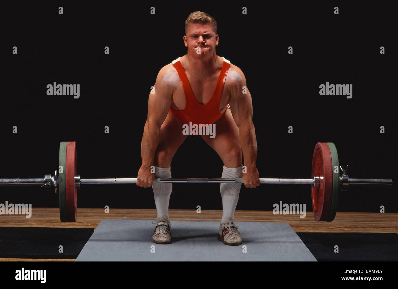 Olympic style weightlifter in action Stock Photo - Alamy