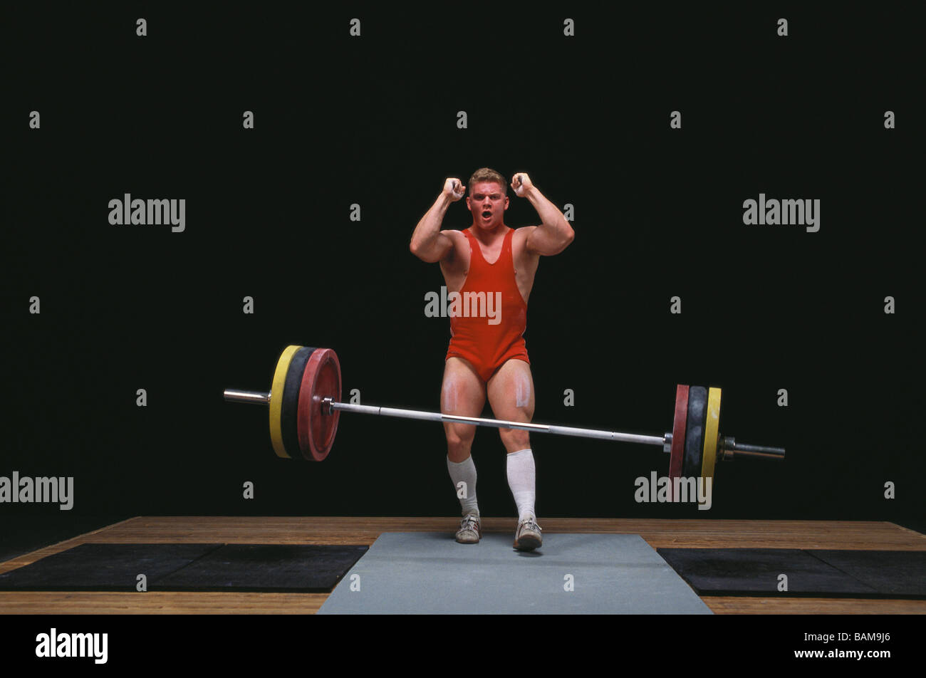 Olympic style weightlifter in action Stock Photo - Alamy