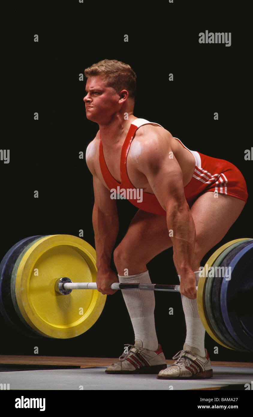 Olympic style weightlifter in action Stock Photo - Alamy