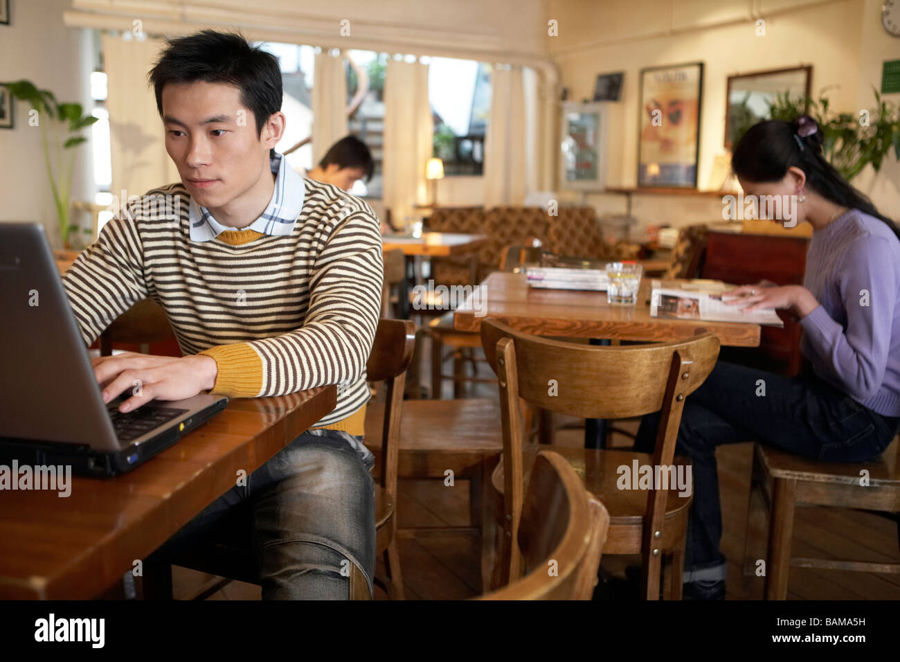 Business people two people sitting at coffee shop tables hi-res stock ...