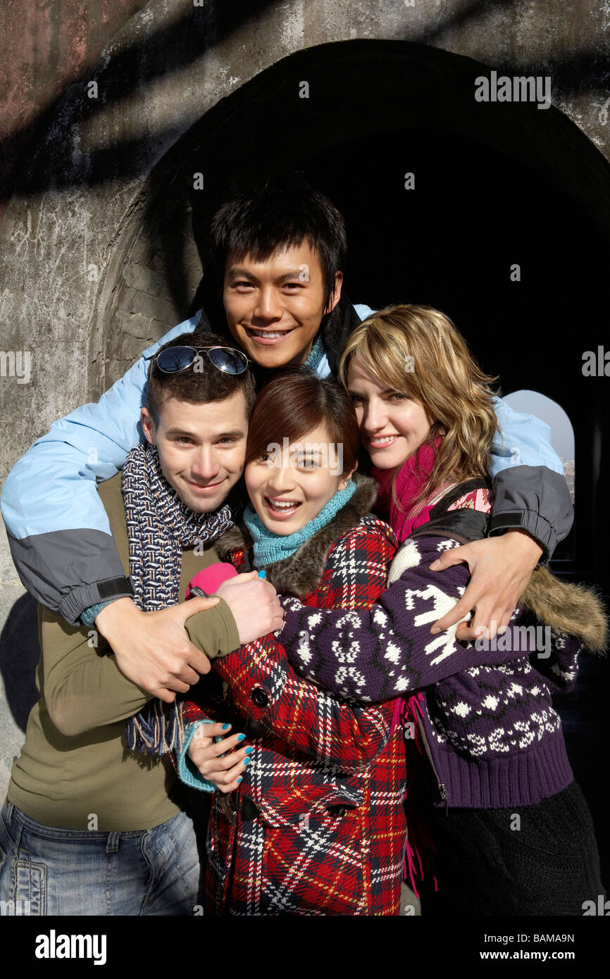 Friends Hugging Each Other And Smiling Stock Photo - Alamy
