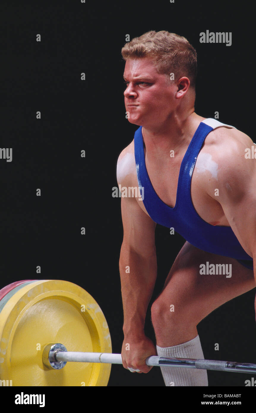 Olympic style weightlifter in action Stock Photo - Alamy